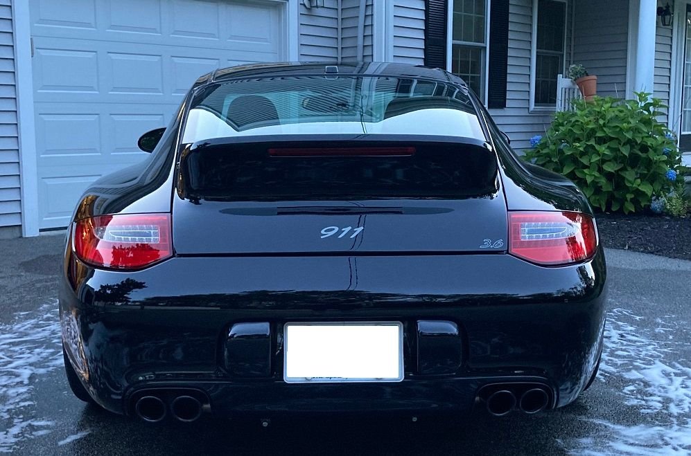 Getty Design 997.2 Ducktail Sport painted 041 black with OEM Sport ...
