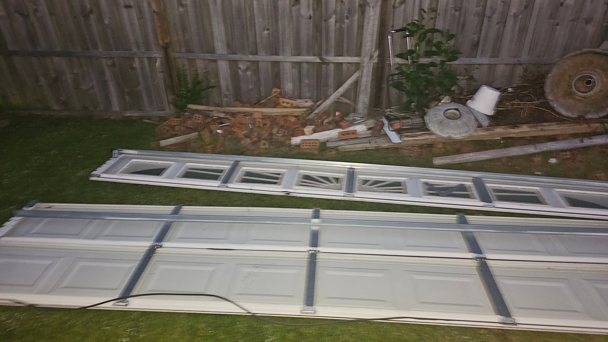 Older type plastic riveted hinge garage door folded on itself ...