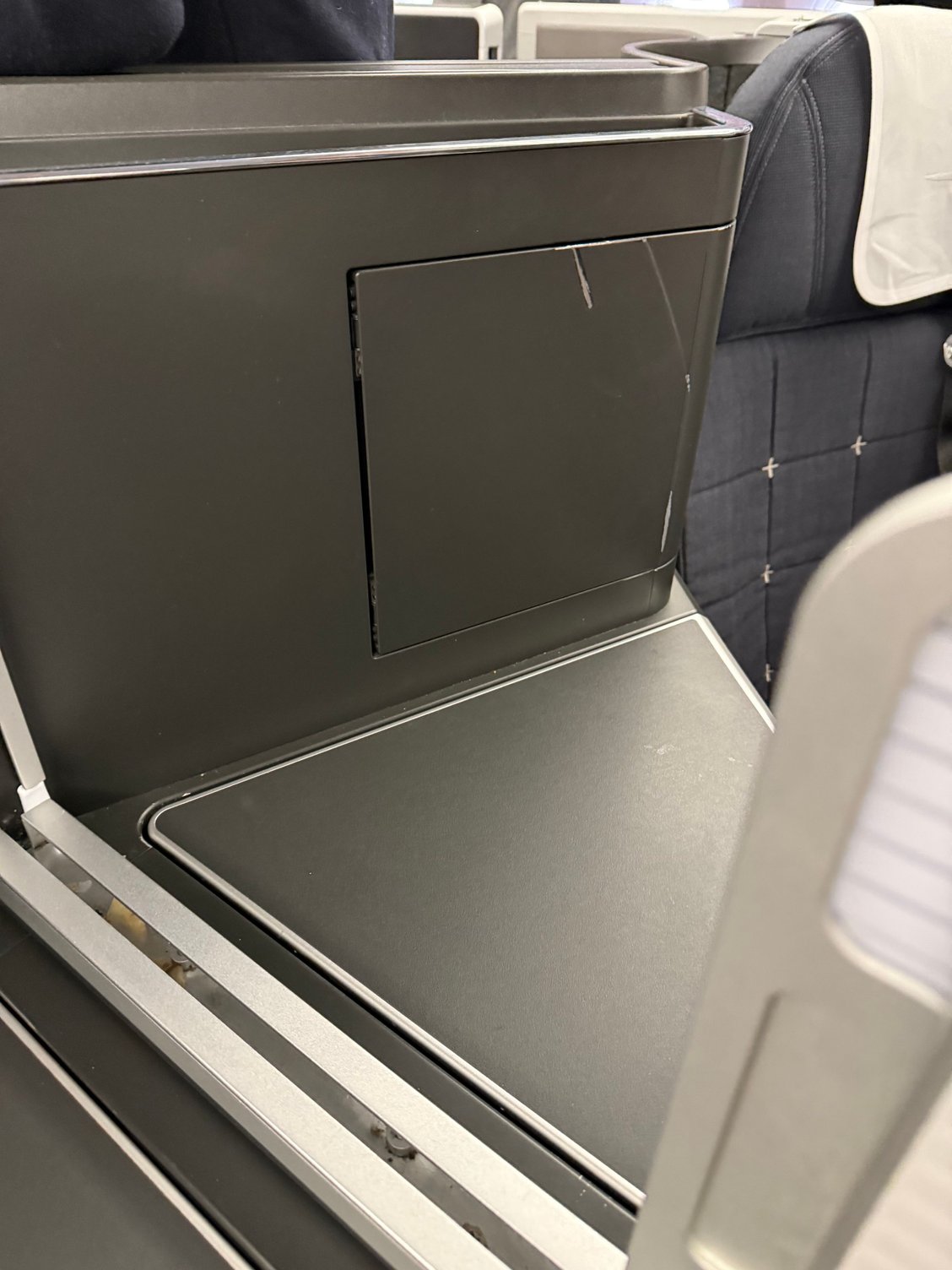 Club suite design fault - catch of storage compartment cover being ...